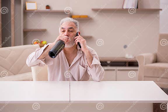 Old Man Drinking Alcohol at Home Stock Image - Image of drunk, booze ...