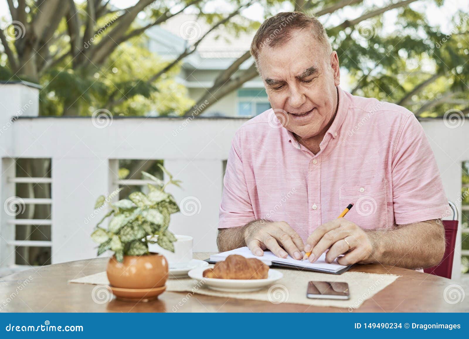 Aged Man Writing in Planner Stock Photo - Image of morning, checking ...