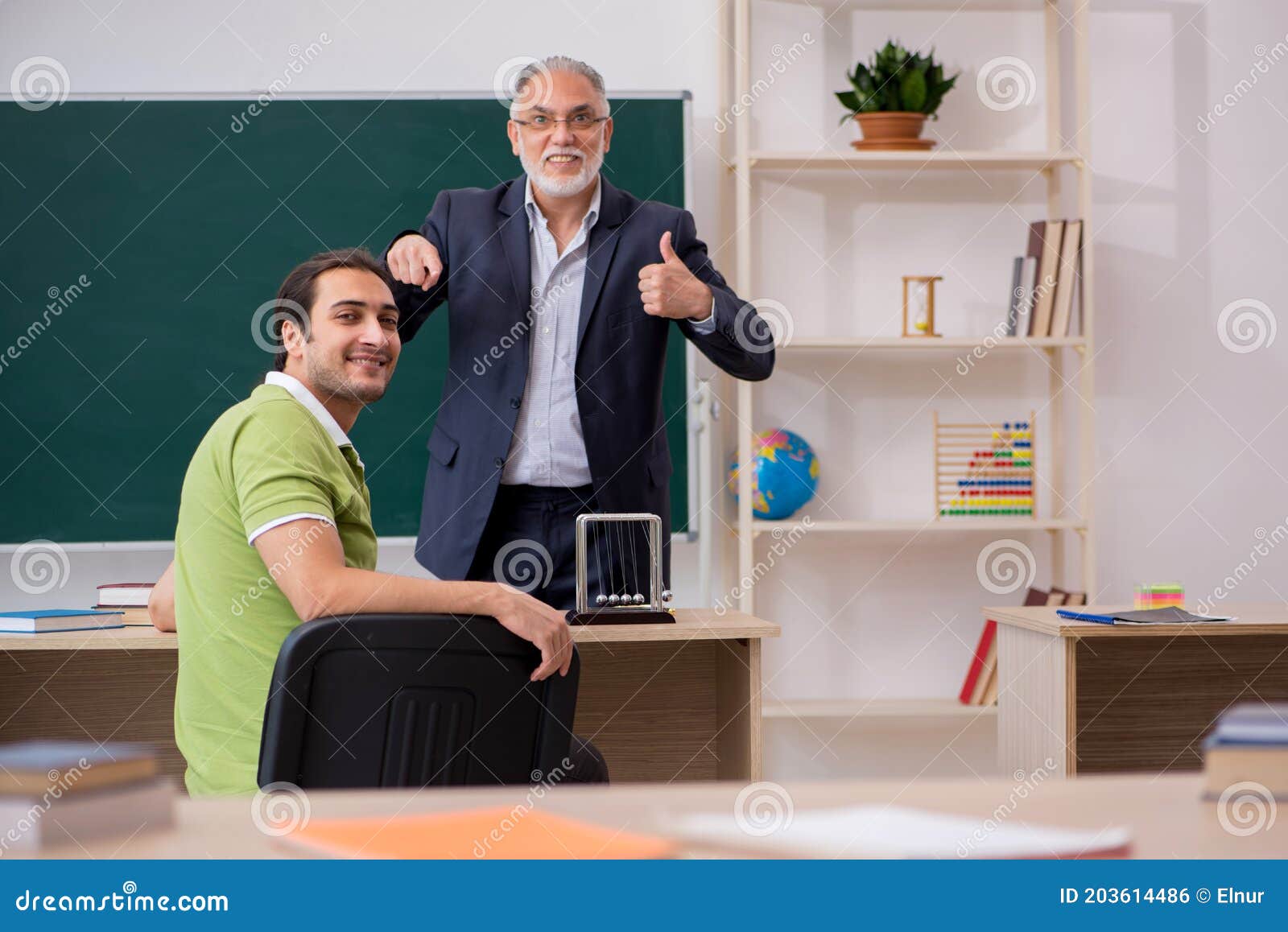 Aged Physics Teacher and Male Student in the Classroom Stock Photo ...