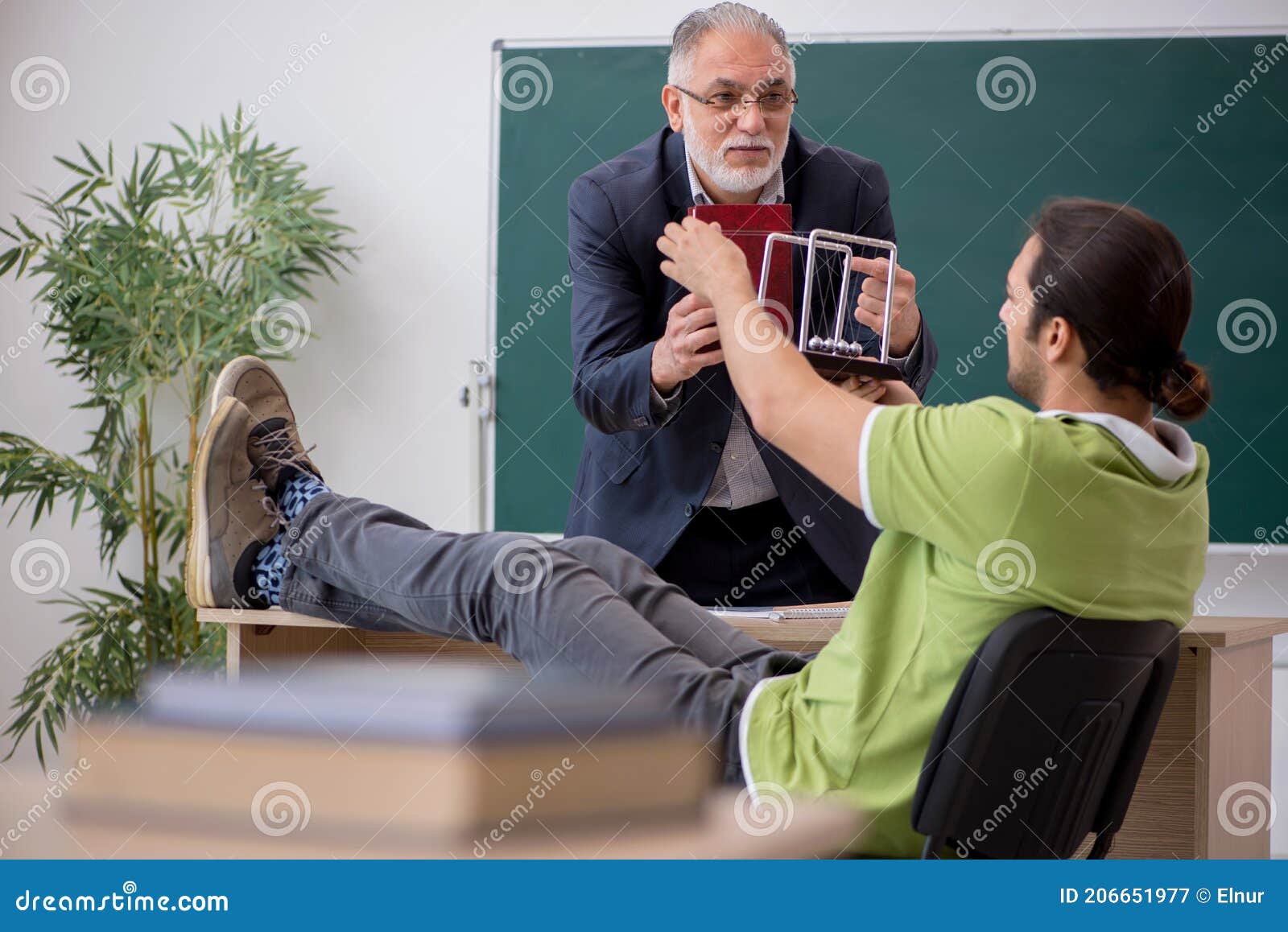 Aged Physics Teacher and Male Student in the Classroom Stock Image ...