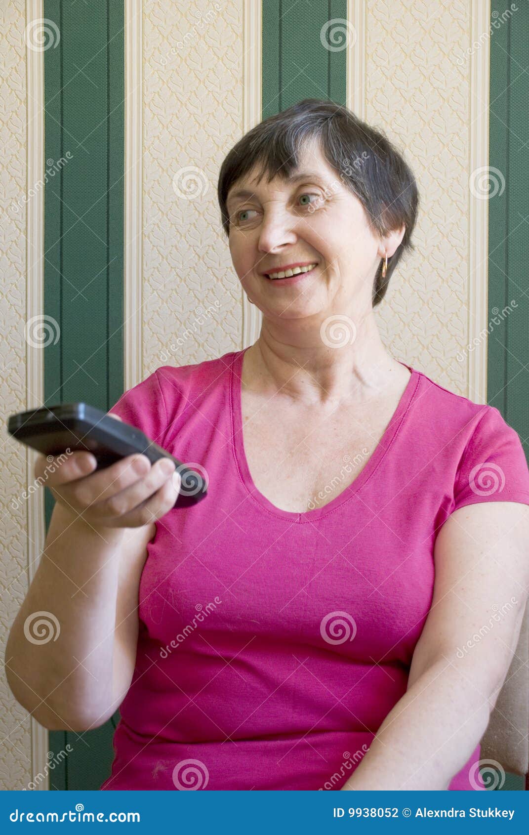 Aged woman with clicker stock photo. Image of clicker - 9938052