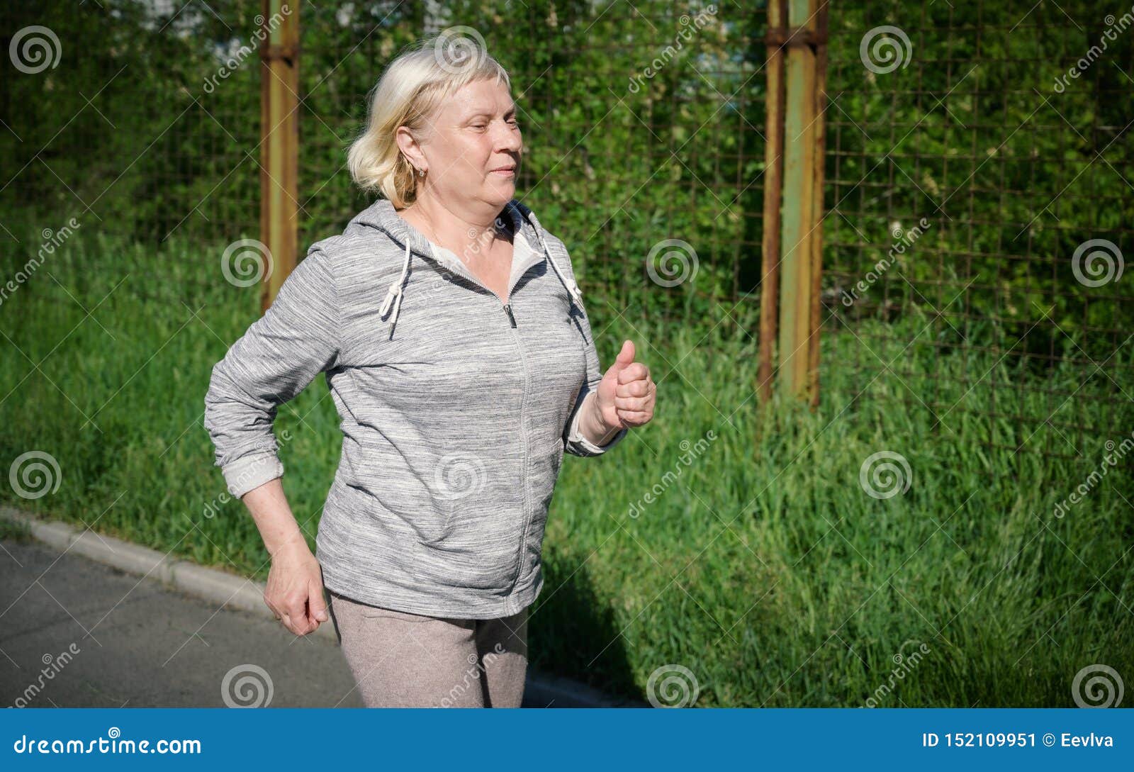 Aged woman jogging. stock image. Image of older, healthy - 152109951