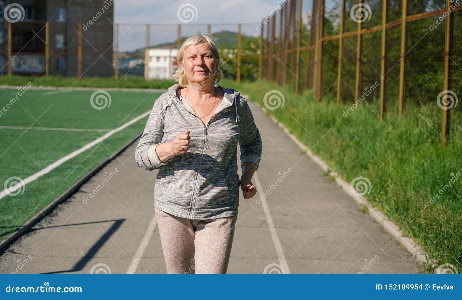 Aged woman jogging. stock photo. Image of fitness, adult - 152109954