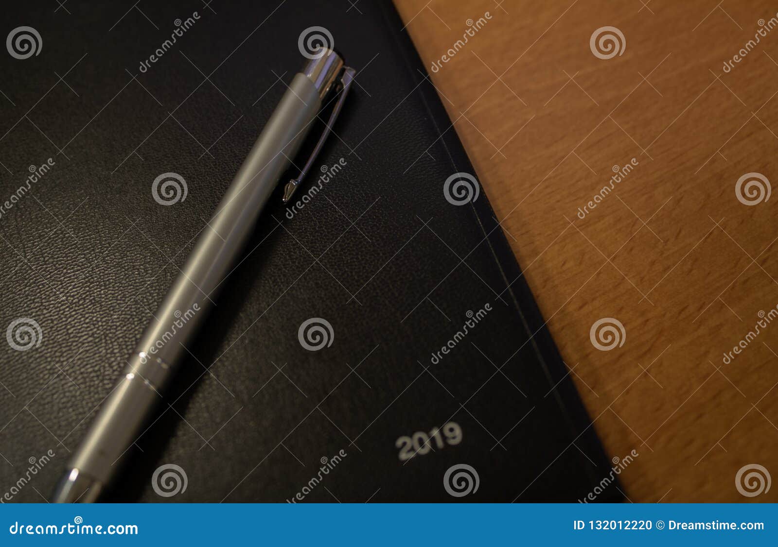 Agenda and Pen Laying on a Desk Stock Photo - Image of wood, collection ...