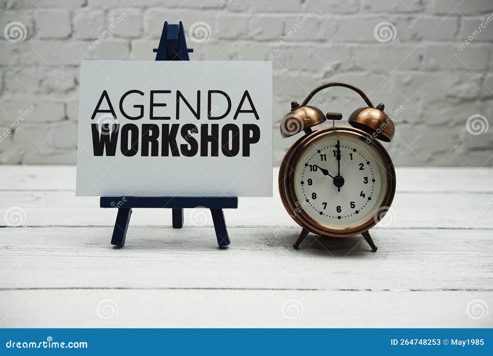 Agenda Workshop Text and Alarm Clock on White Brick Wall and Wooden ...