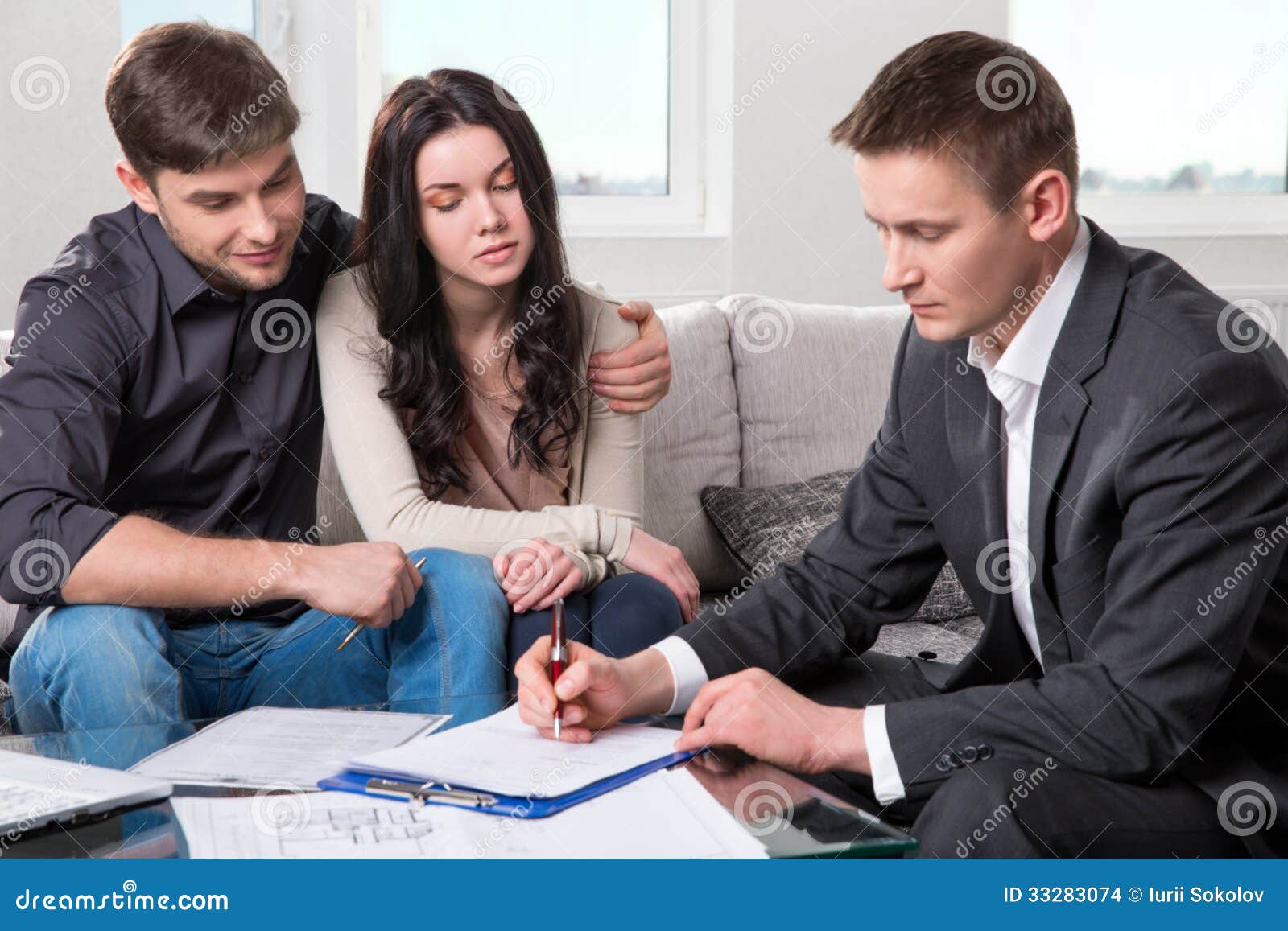 Agent Advises the Couple, Signing Documents Stock Photo - Image of ...
