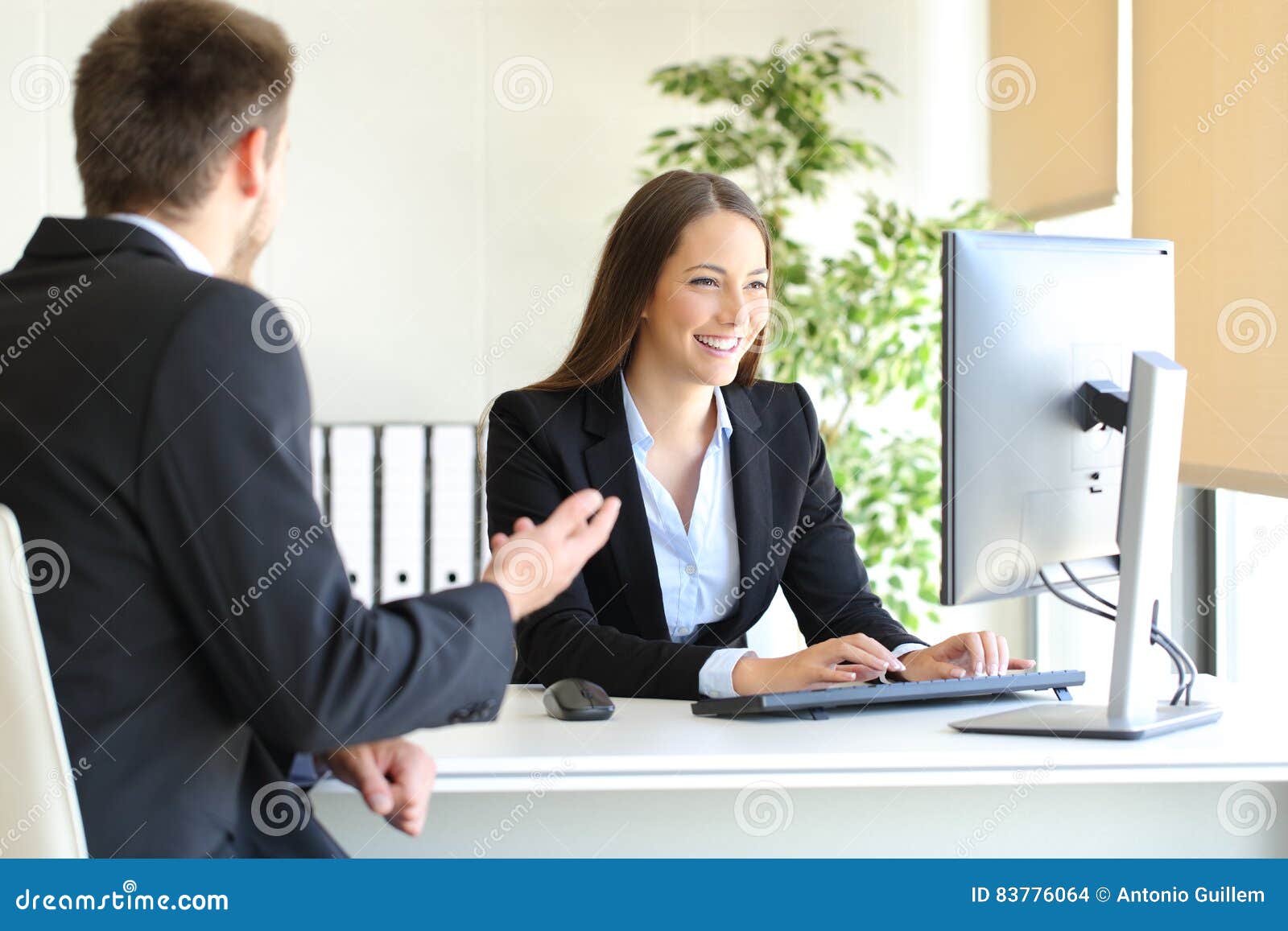 Agent Attending a Client at Office Stock Photo - Image of agent ...