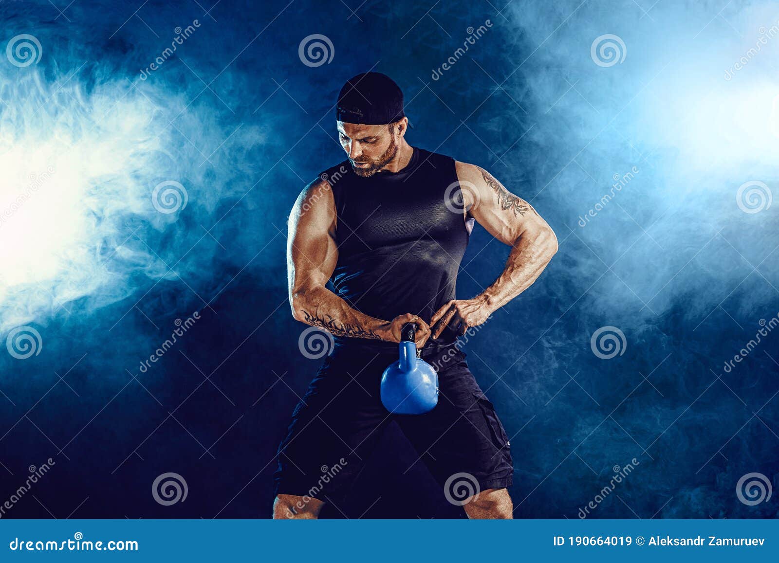 Aggressive Bearded Muscular Bodybuilder Doing Exercise for the Biceps ...
