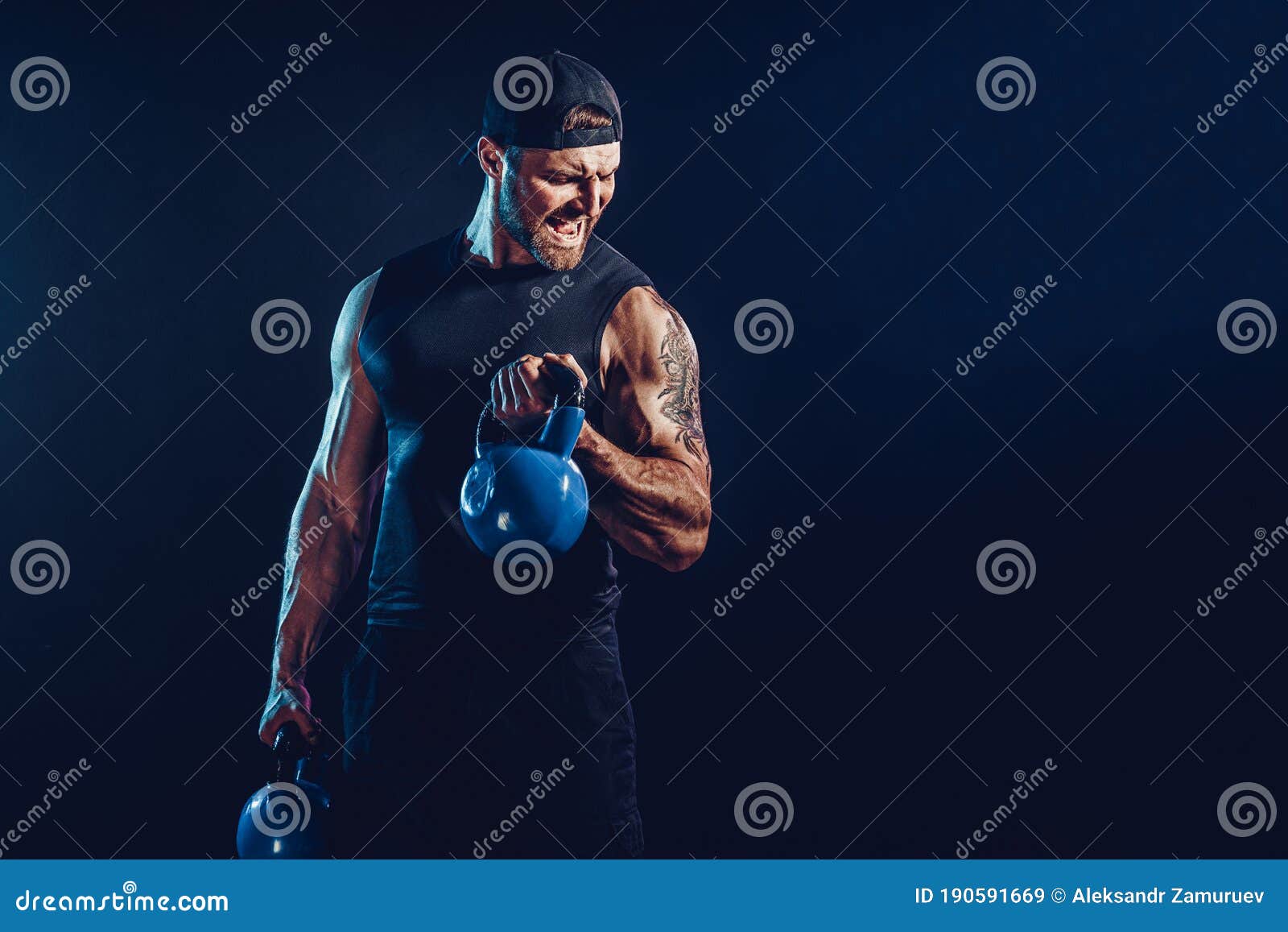Aggressive Bearded Muscular Bodybuilder Doing Exercise for the Shoulder ...