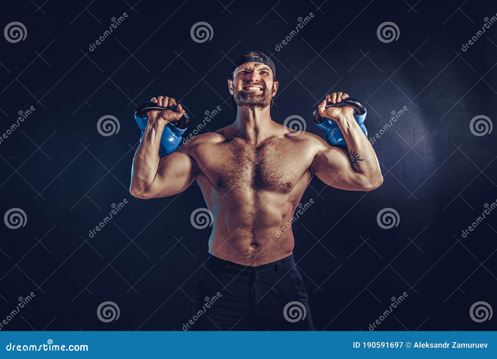 Aggressive Bearded Muscular Bodybuilder Doing Exercise for the Shoulder ...