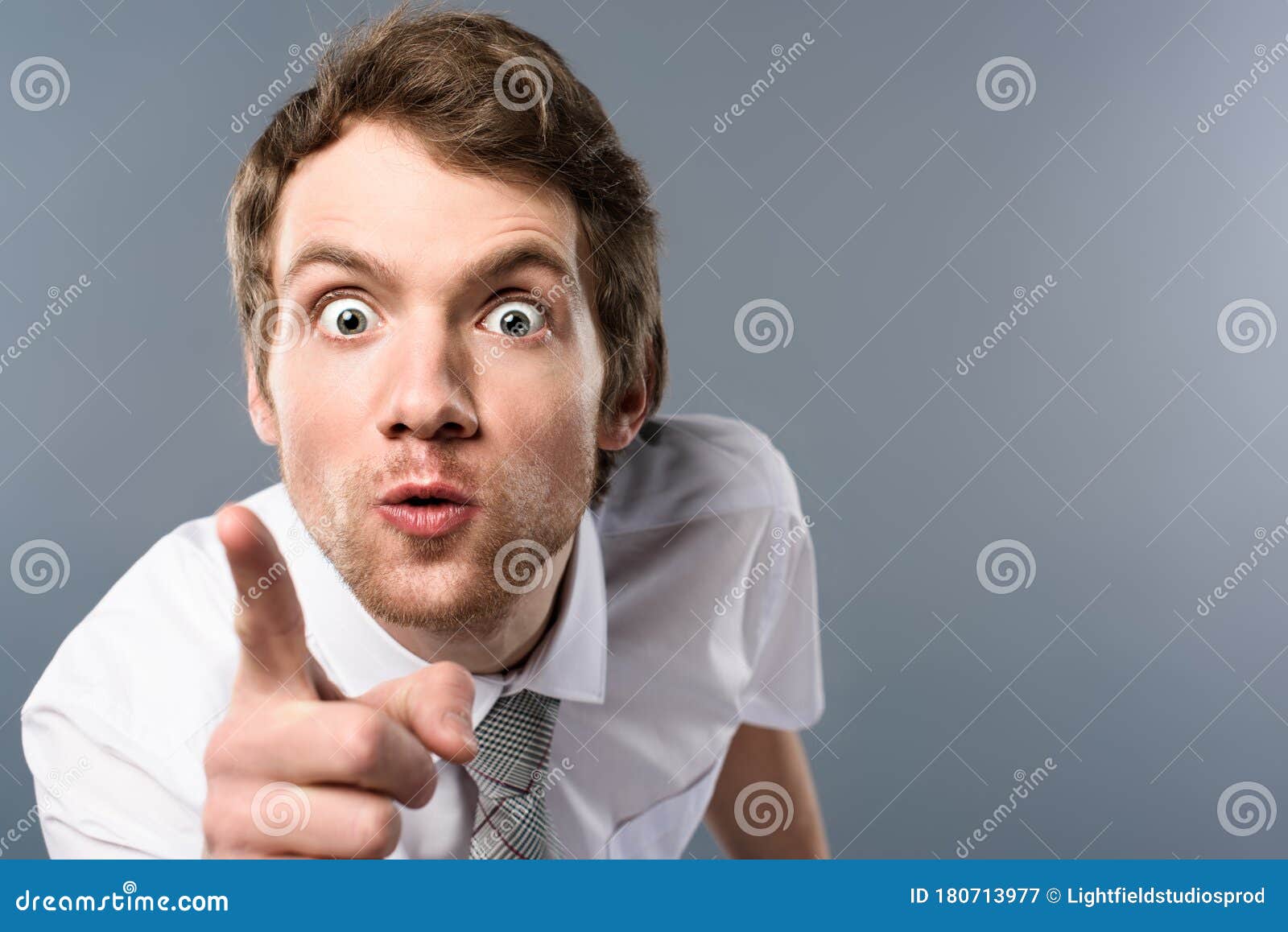 Aggressive Businessman with Funny Face Expression Pointing with Finger ...