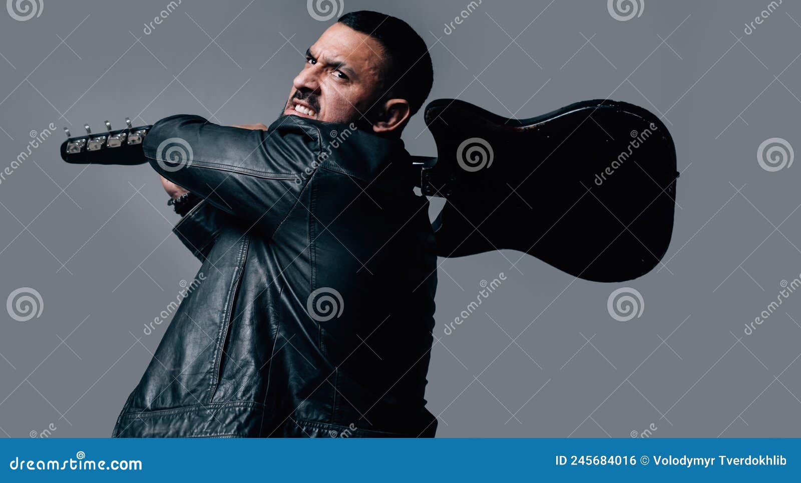 Aggressive Guitarist Standing with Electric Guitar Guitarist Breaks ...