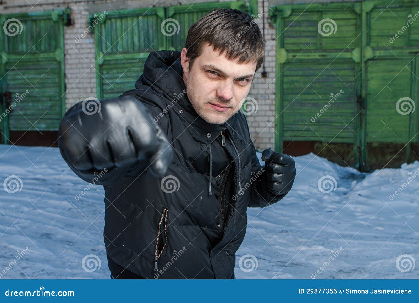 Angry Man Punching in a Street Fight. Stock Photo - Image of ...