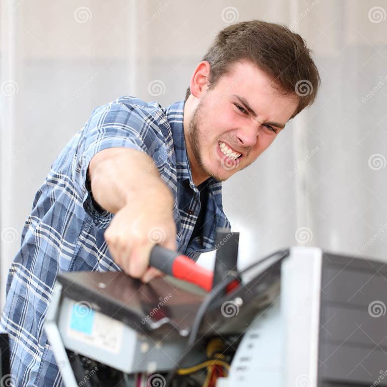 Aggressive Man Hitting a Computer with a Hammer Stock Photo - Image of ...