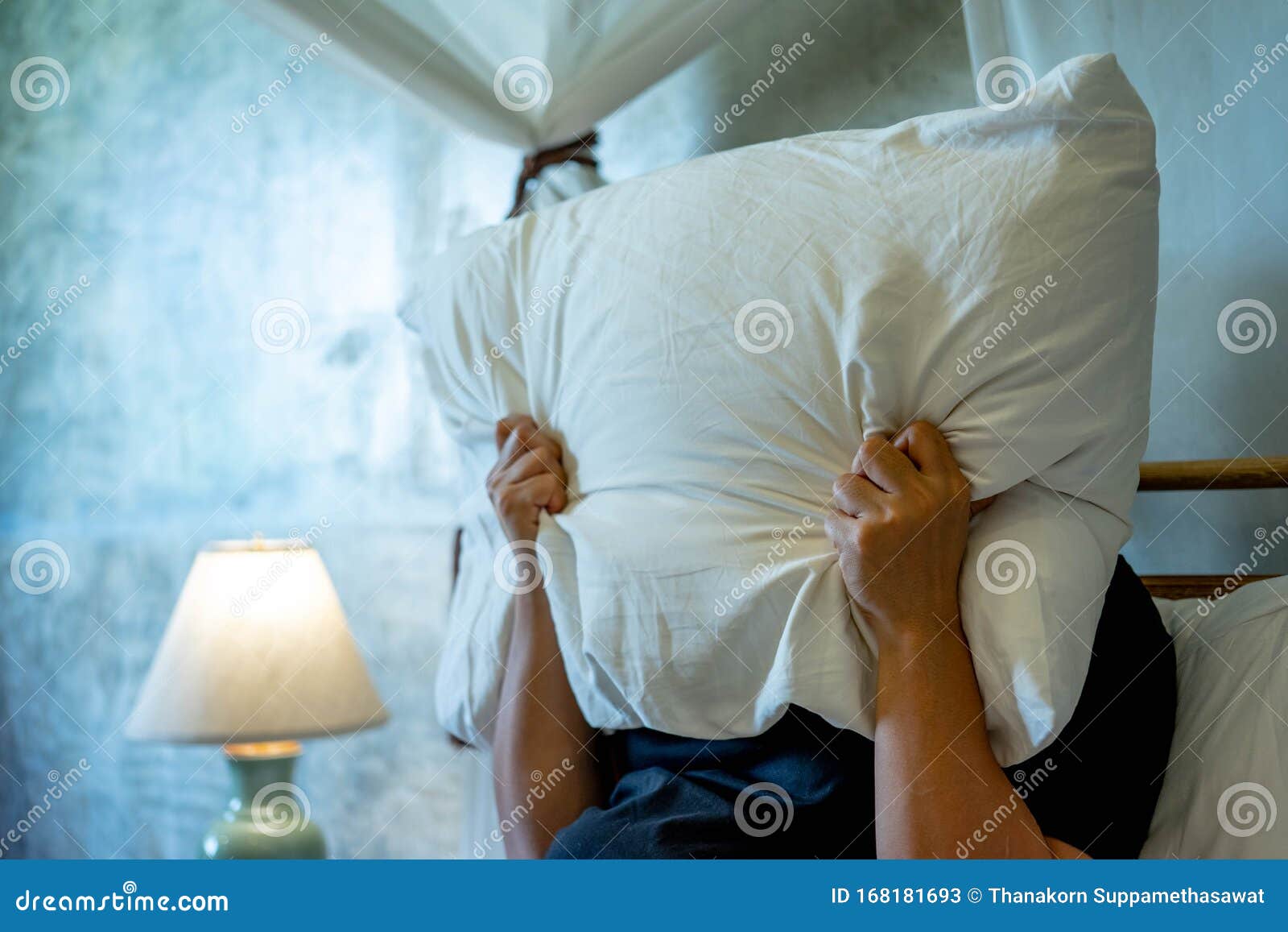 Aggressive Woman Covered Her Face with Pillows and Screams Stock Image ...