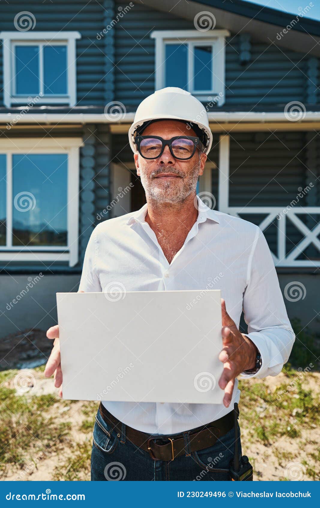 Confident Engineer Holding Blank Piece of Paper Stock Photo - Image of ...