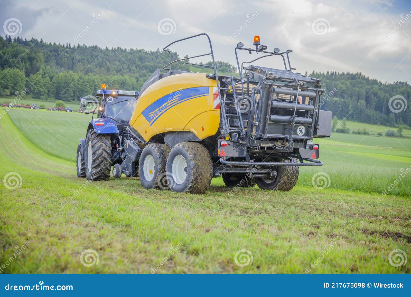 Machinery on a green field stock photo. Image of machine - 217675098