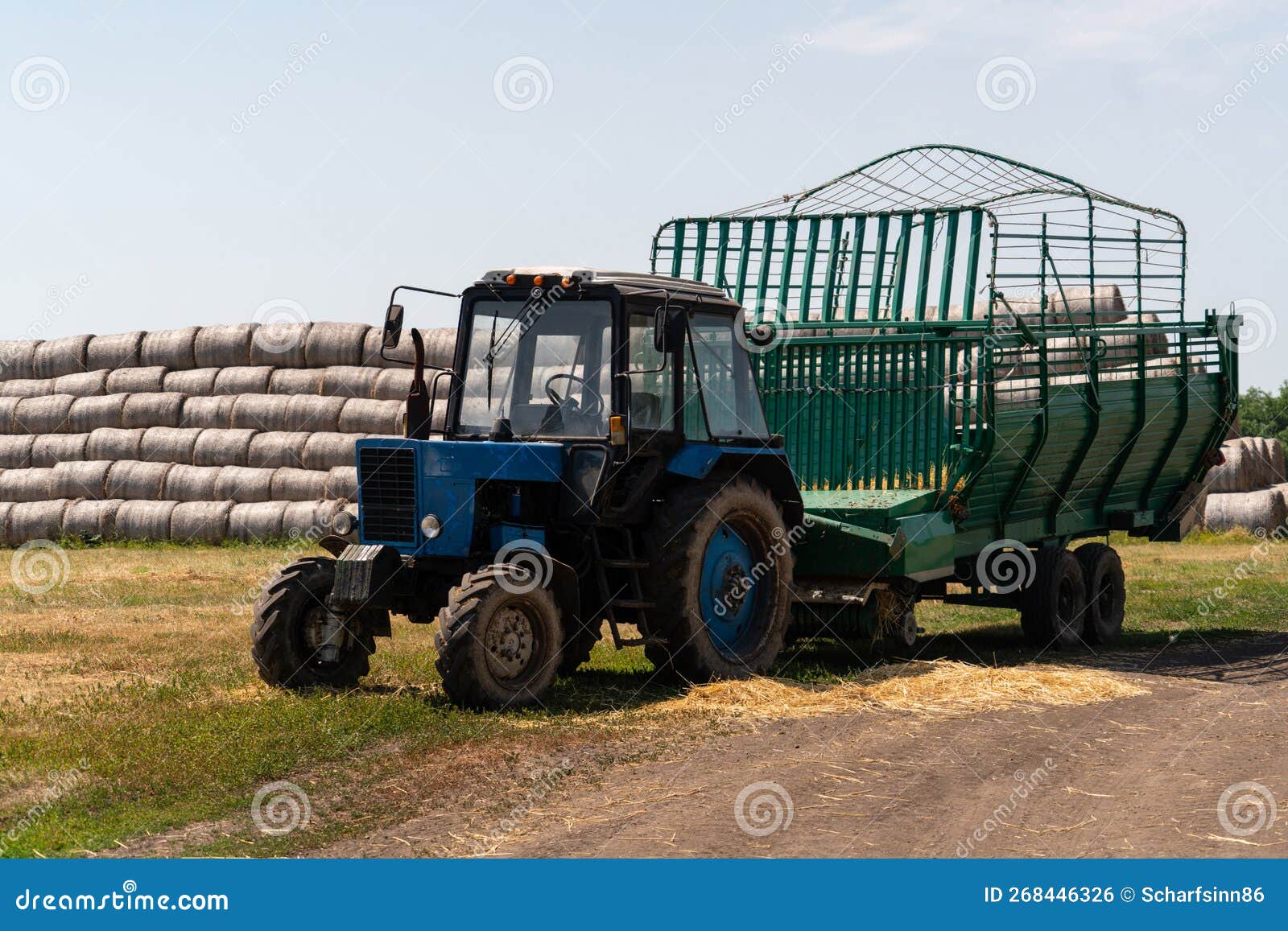 Agricultural Tractor with Straw Bales Stock Photo - Image of ...