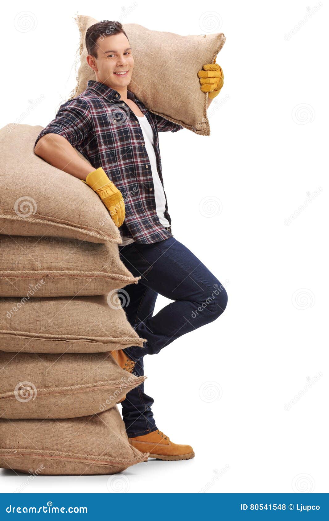 Agricultural Worker with Burlap Sack Leaning on Stack of Burlap Stock ...