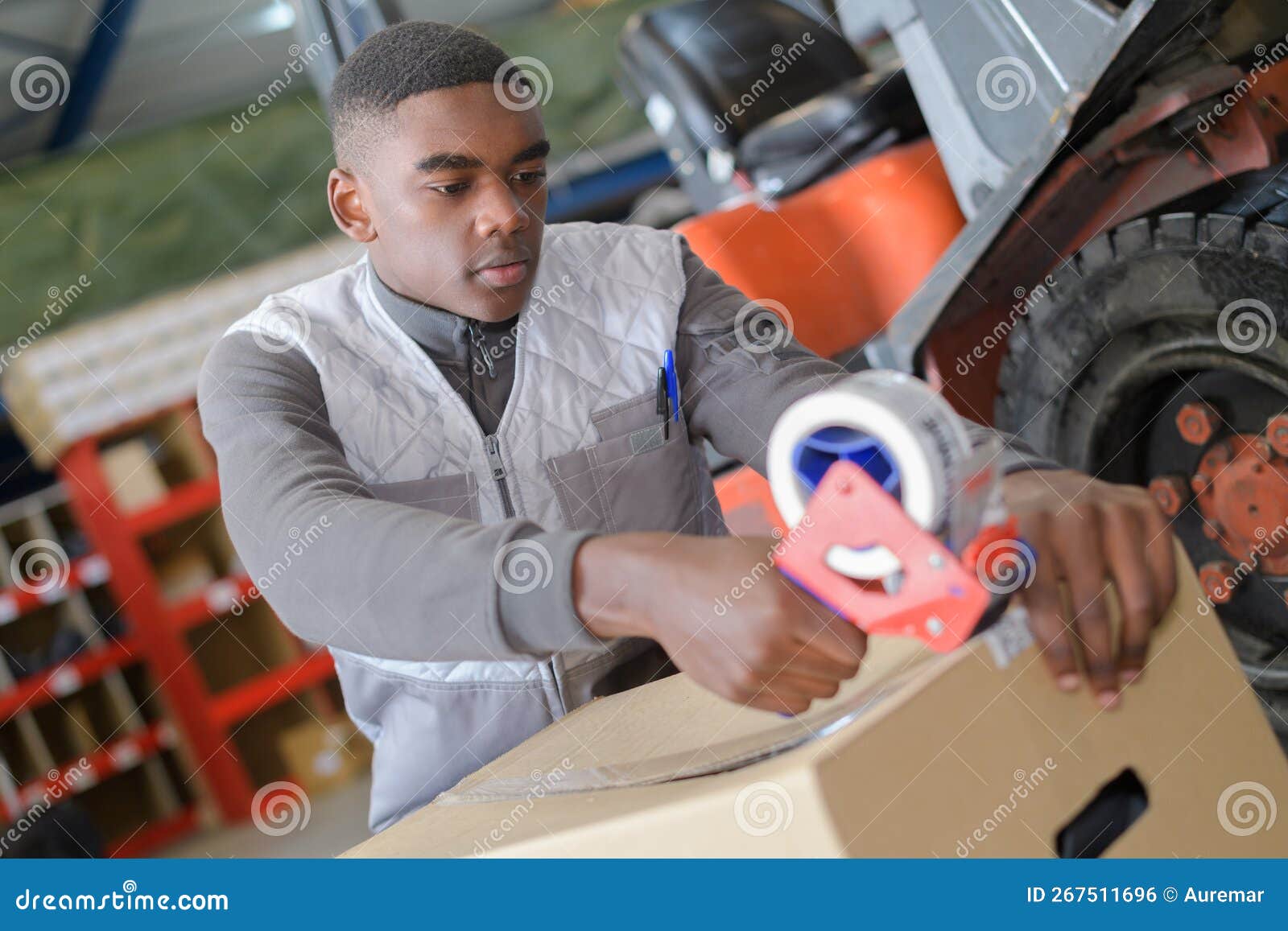Worker Packaging Order For Metal Bolts Into Cardboard Box Royalty-Free ...