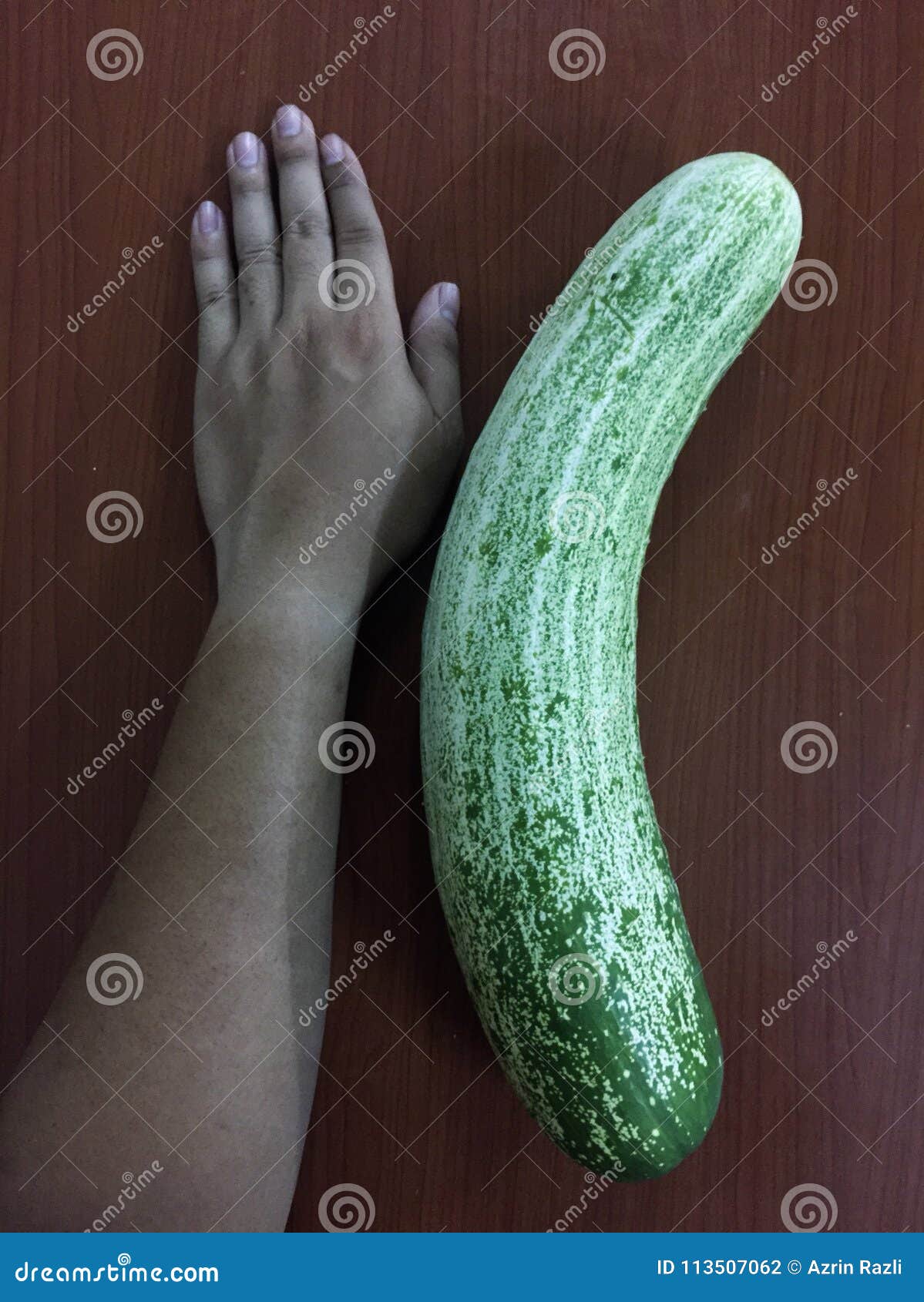 Comparison of Cucumber and Human Hand Stock Photo - Image of hand ...