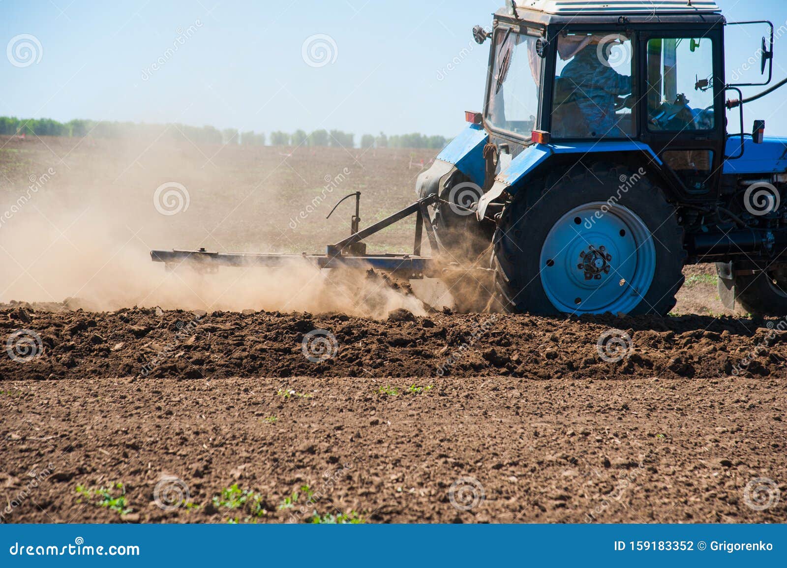 Agriculture with a tractor editorial photography. Image of machinery ...