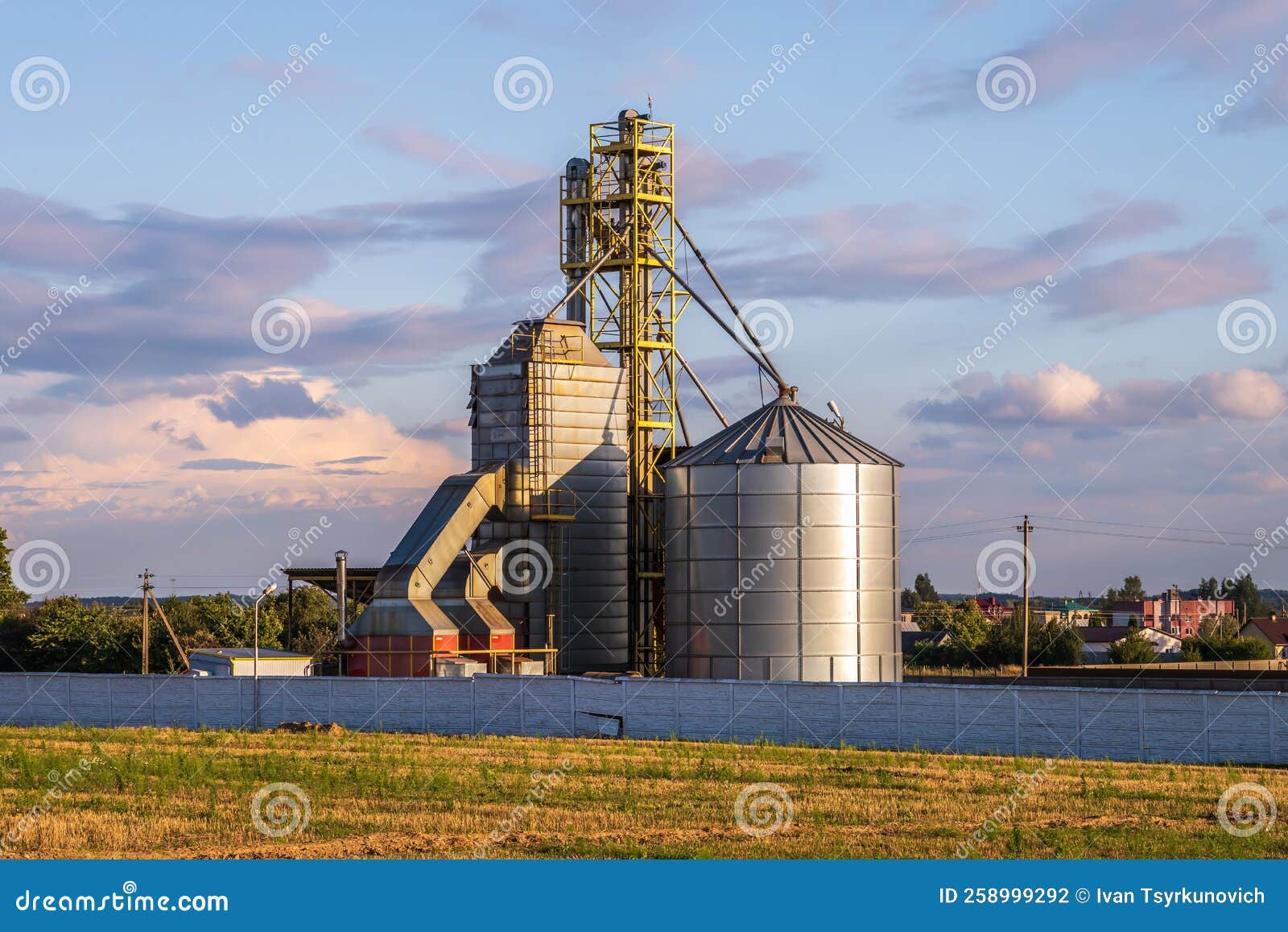 Granary Elevator On Blue Sky Background. Silo, Crops Storage. Loading ...