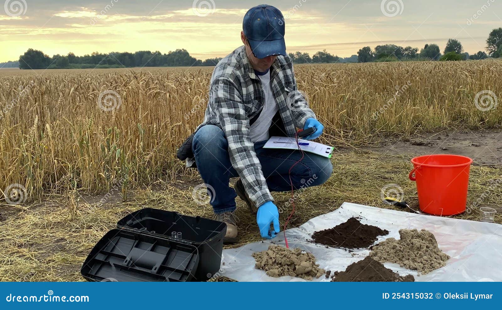 Agronomist Preparing Measurement by Using Digital Soil Tester Outdoors ...
