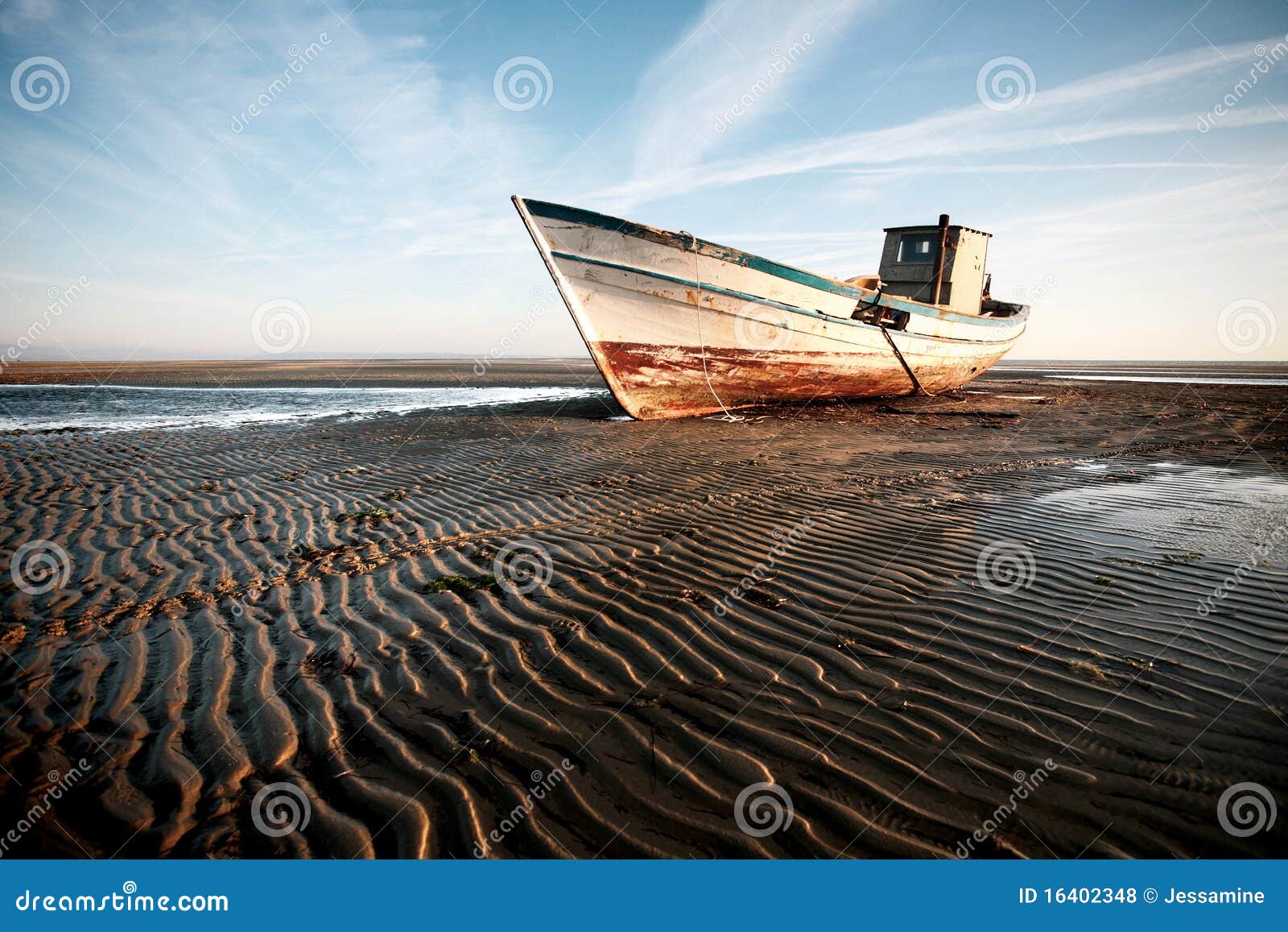 Aground boat on the beach stock photo. Image of blue - 16402348
