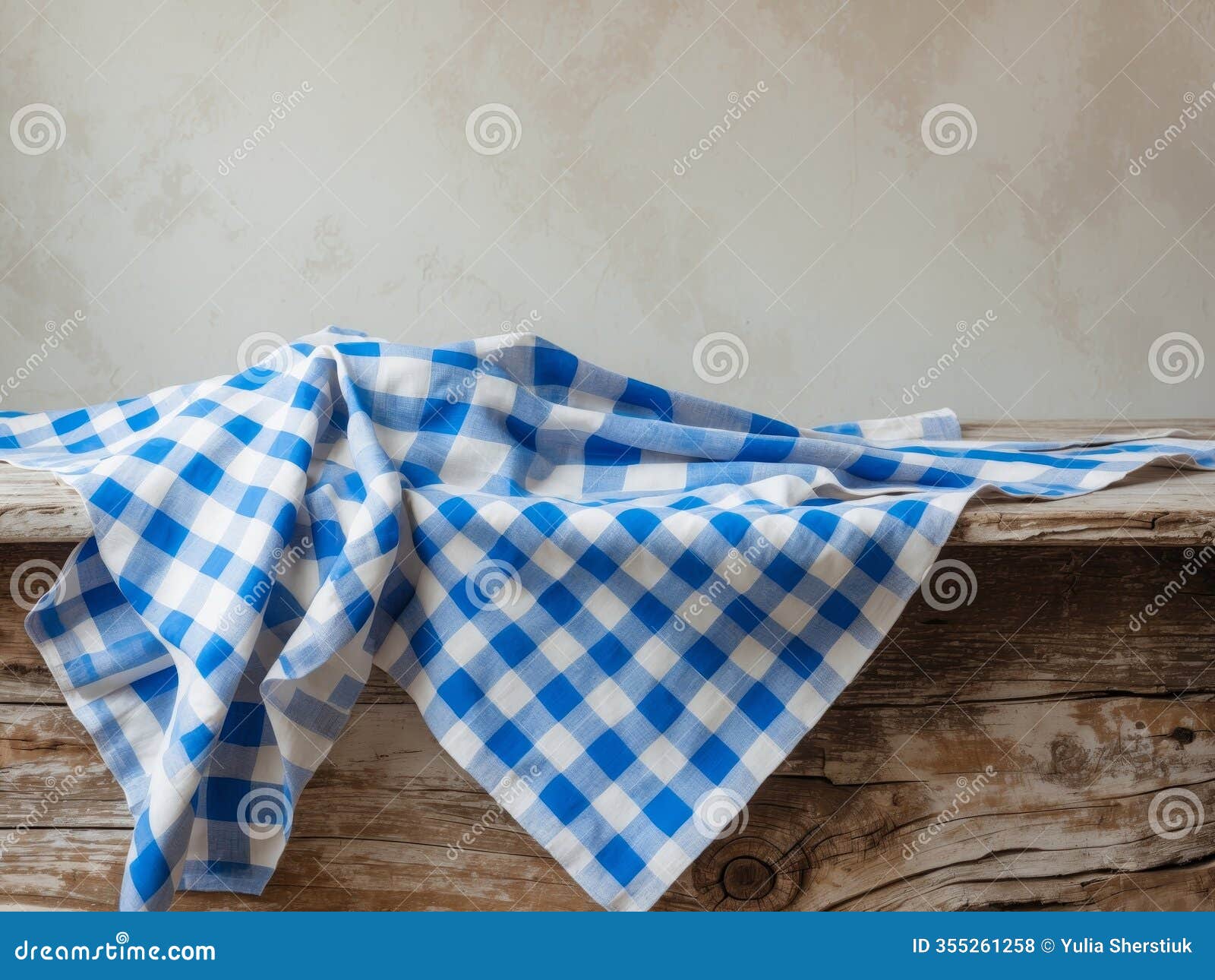 Blue and White Checkered Tablecloth on Rustic Wooden Surface Background ...