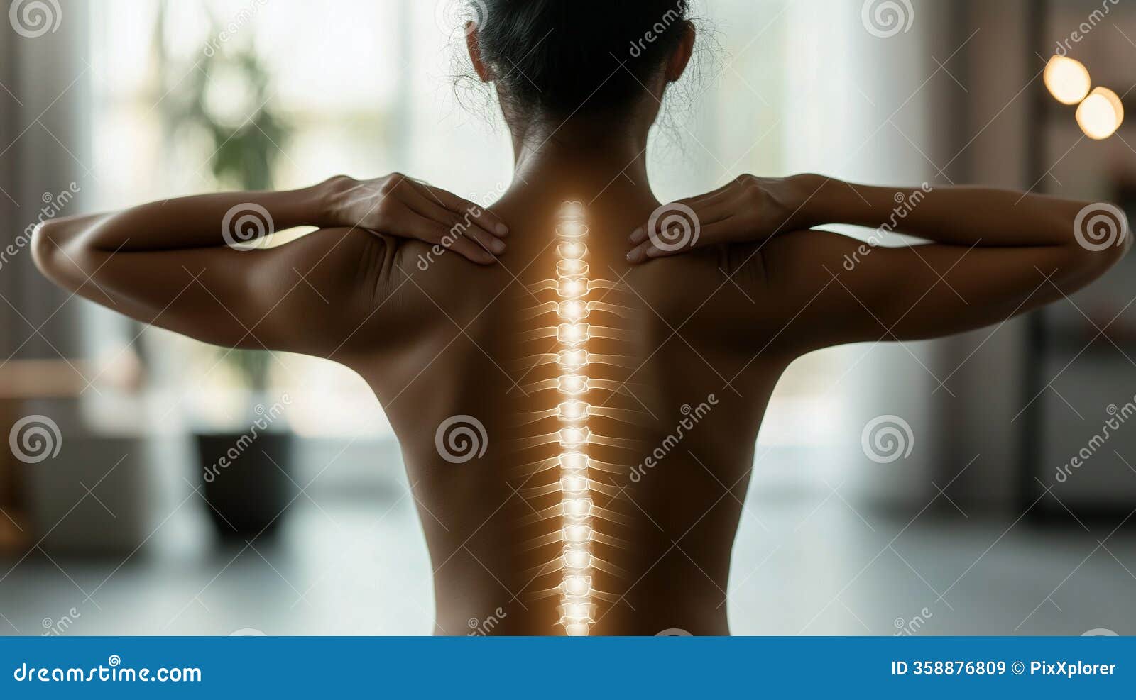 A Person, Visible from the Back, is Holding Their Shoulders with Both ...