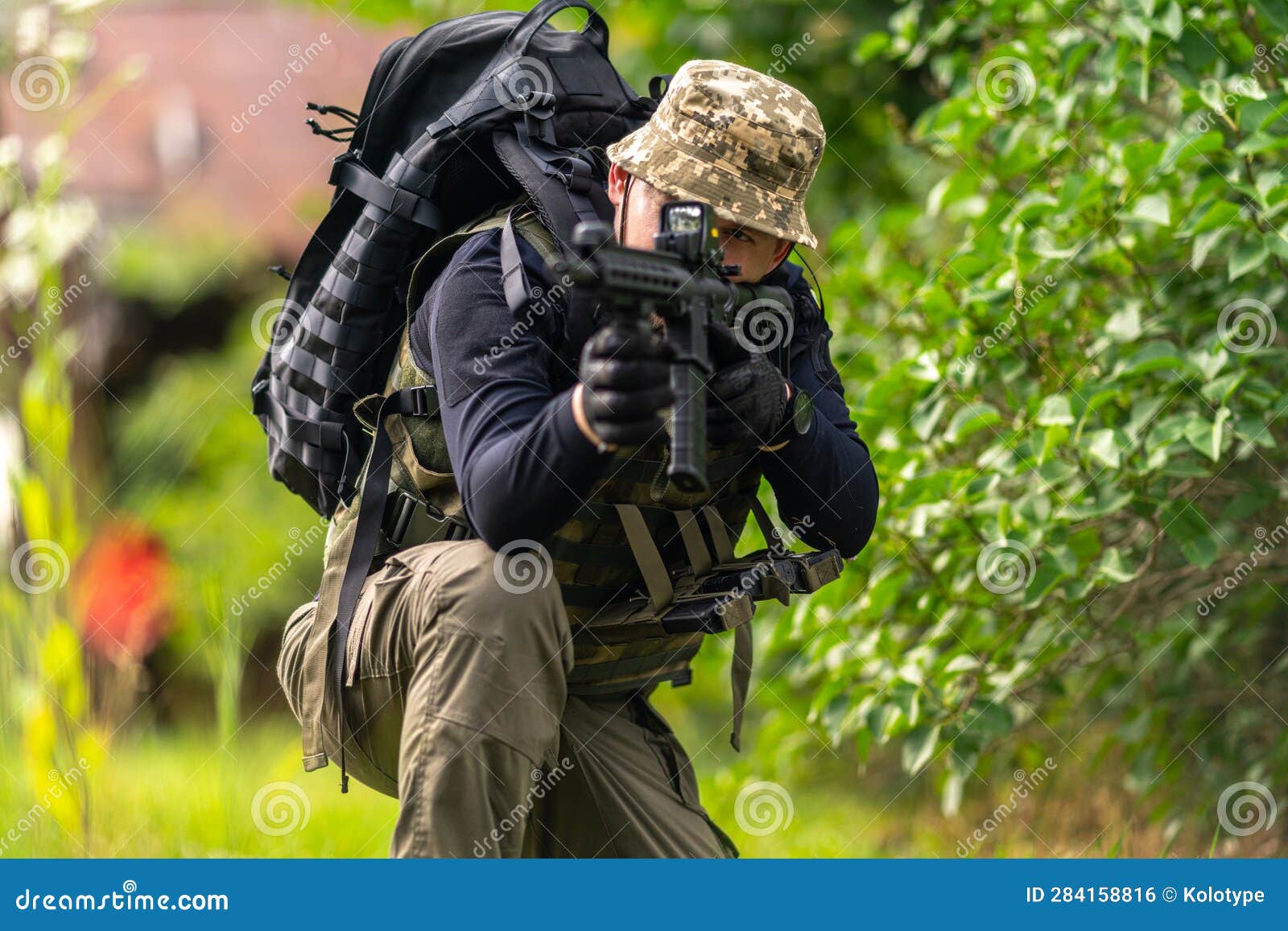 Aiming while seated stock photo. Image of assault, equipped - 284158816