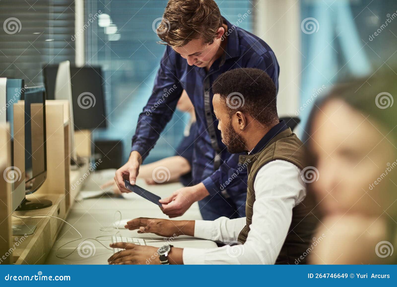 Aiming To Achieve the Exceptional Together. a Group of Designers Working on Computers in an ...