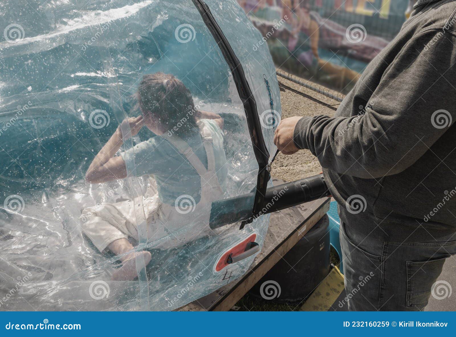 Air Balloon Inflation Process. Attraction Balloon on the Water with a ...
