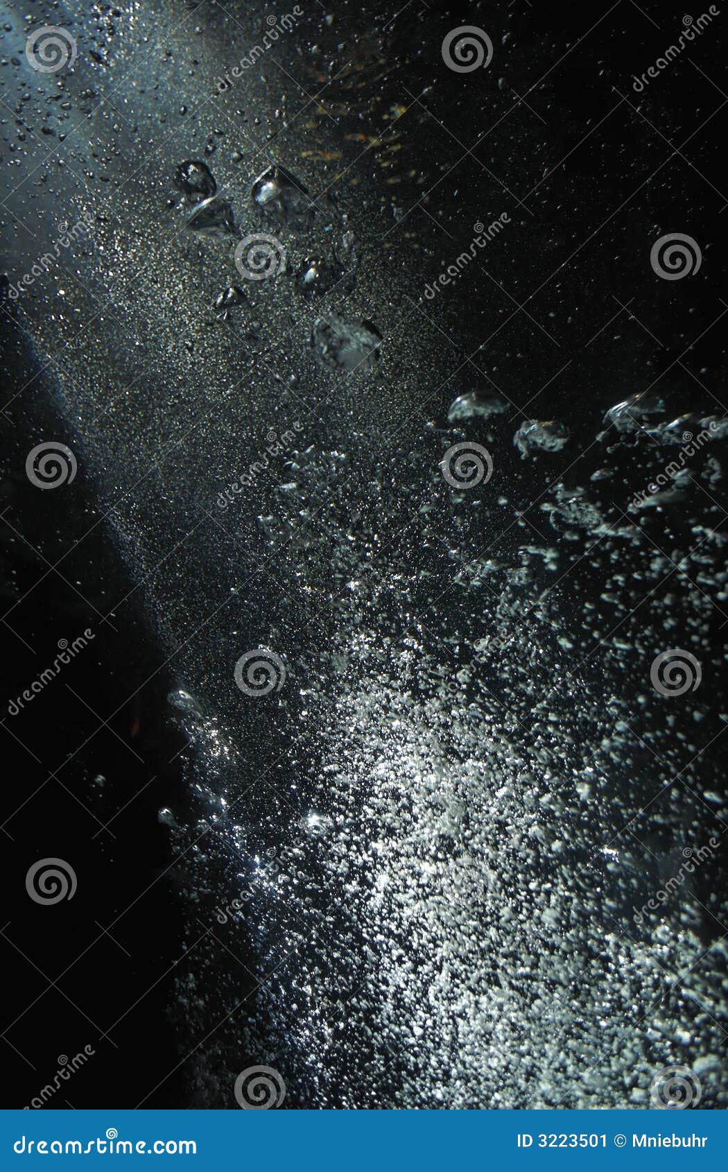 Air Bubbles Rising in Shaft of Light Against Black Stock Image - Image ...
