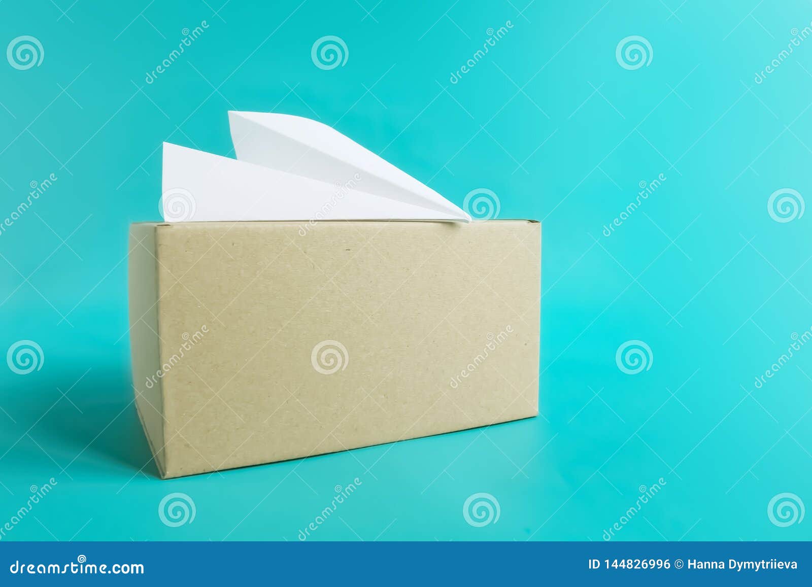 Air Cargo Concept. Paper Plane on Brown Box on Blue Background Stock ...