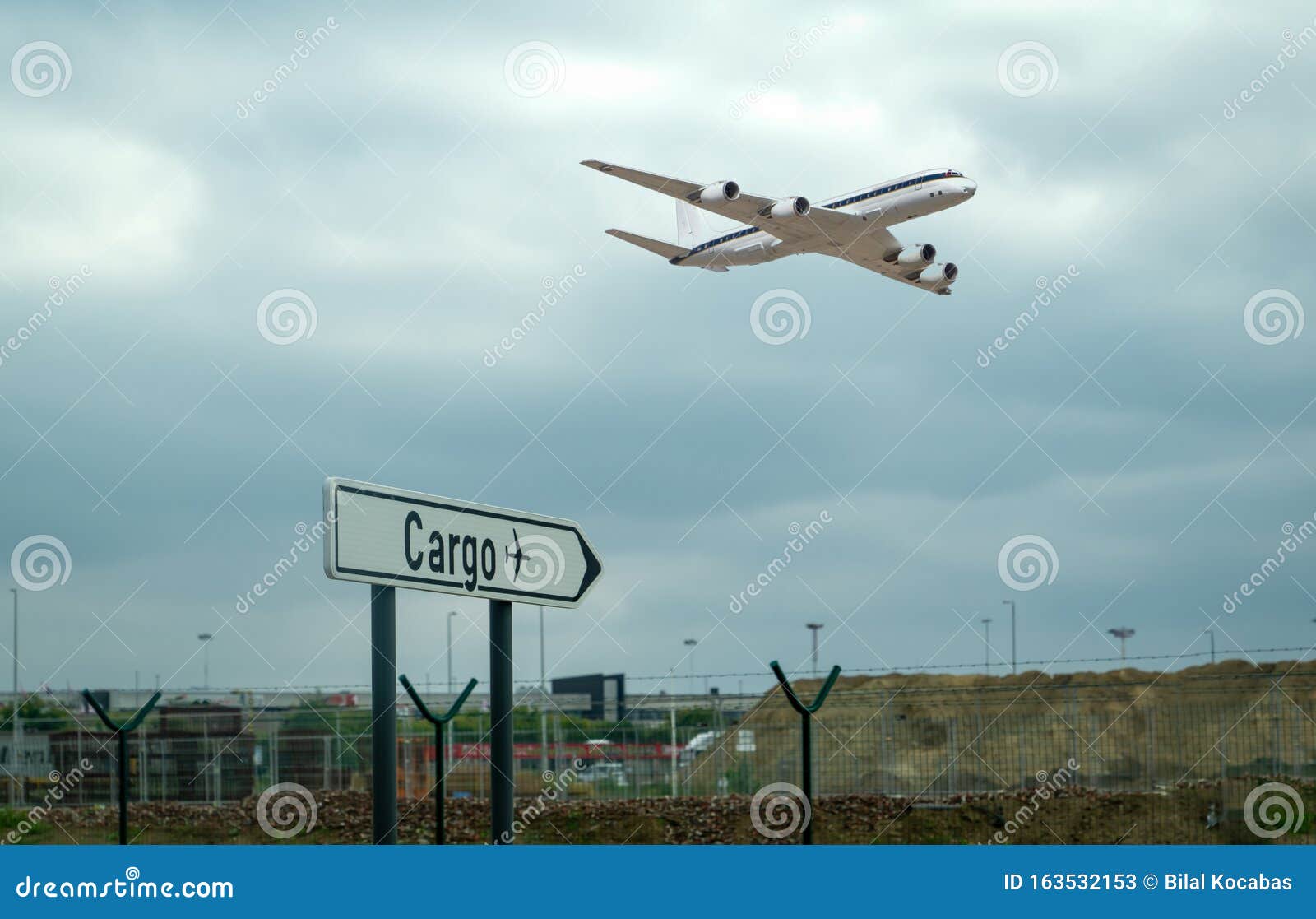 Air Cargo Sign on Ground and a Cargo Flight on the Air Stock Image ...