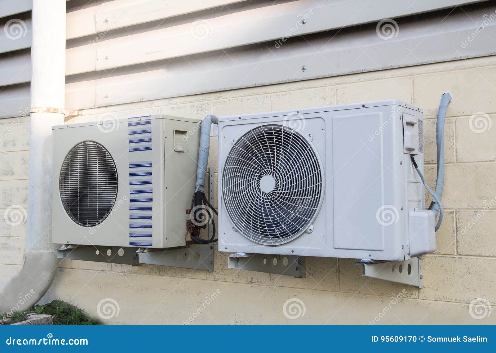 Air Compressor on Wall Pedestal with Siding Factory Wall Background ...