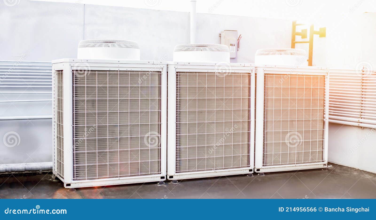 Rows Of Rooftop HVACs On The Roof Deck Of An Office Tower With Taller ...