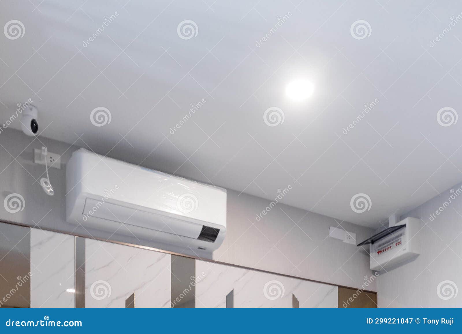 Air Conditioner Inside the Room, Hand Holding Control Switch of Home ...