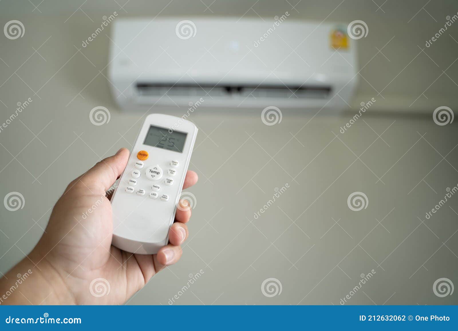 Air Conditioner Inside The Room With Man Operating Remote Controller ...