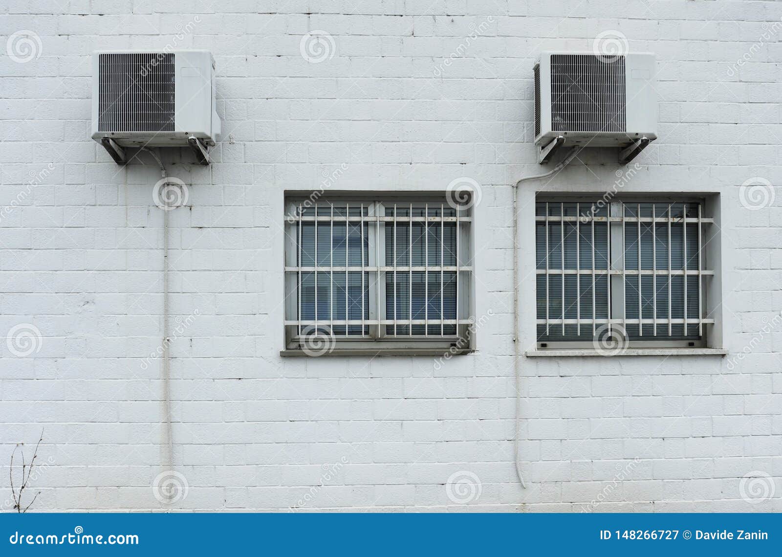 An Air Conditioner Is Installed On The Wall Of The Residential Building ...