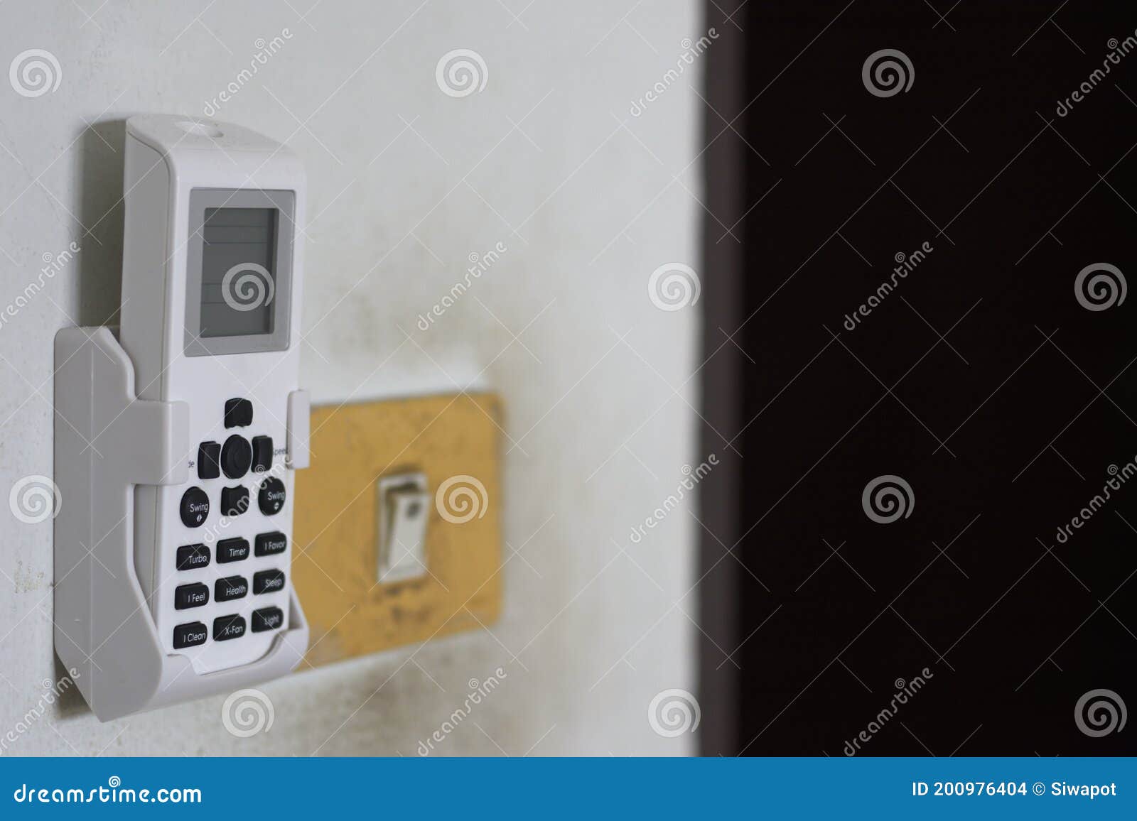 Air Conditioner Remote Control on White Wall. Stock Photo - Image of ...