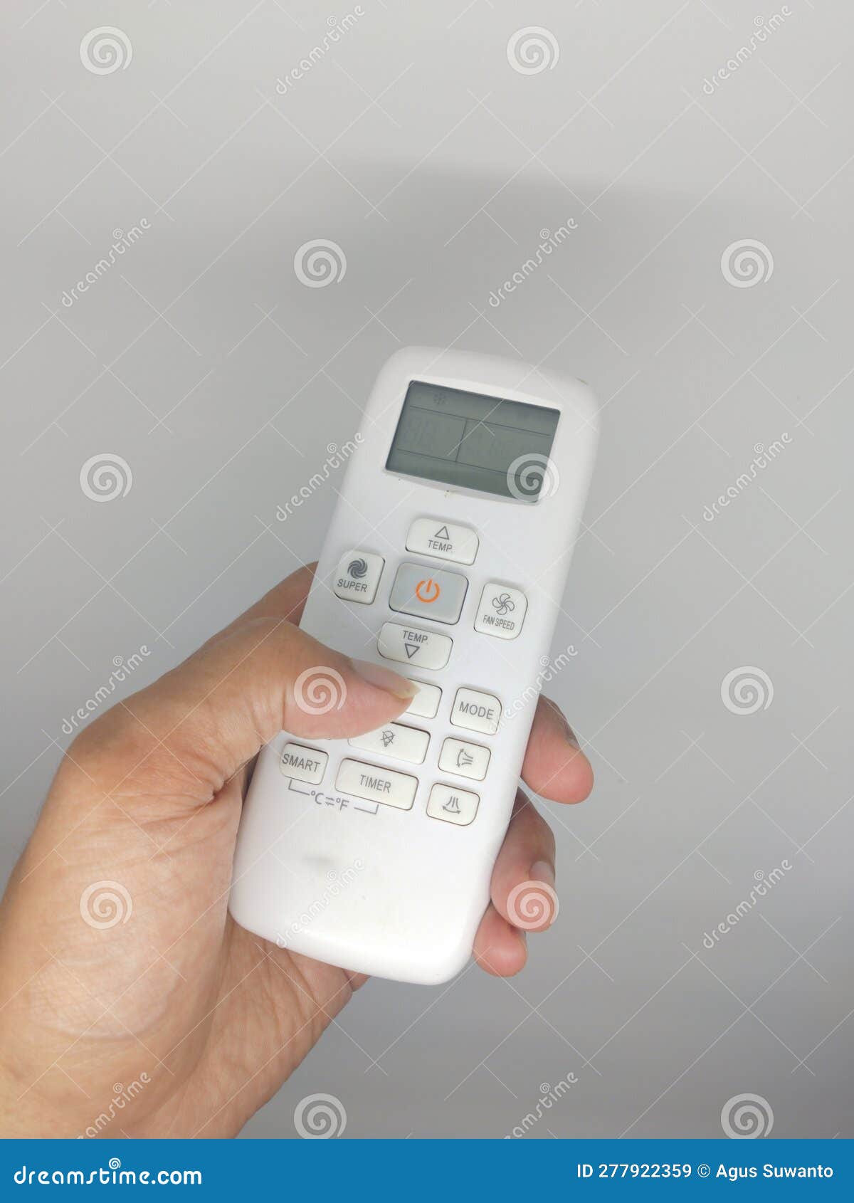An Air Conditioner Remote Controller Isolated on White Background Held ...