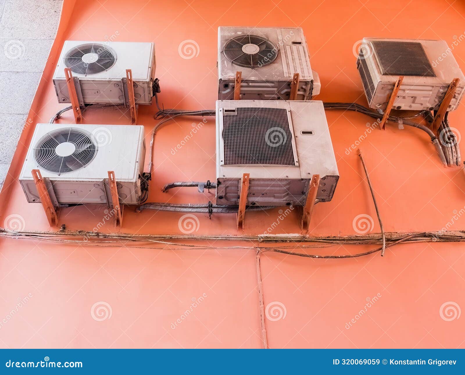 Air Conditioners Hanging on the Orange Wall Stock Image - Image of line ...