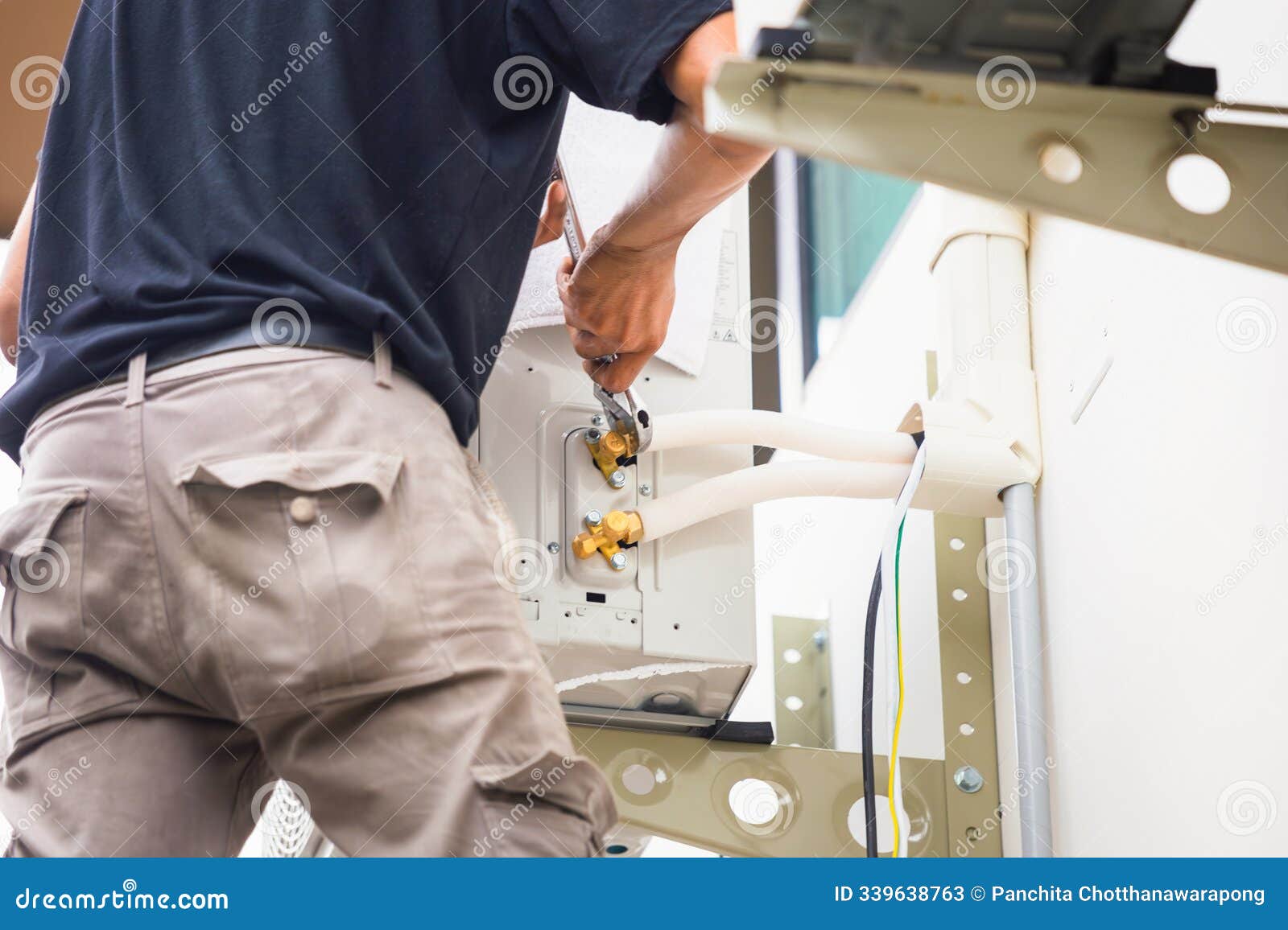 Air Conditioning Repair, Technician Man Hands Using a Wrench Fixing ...
