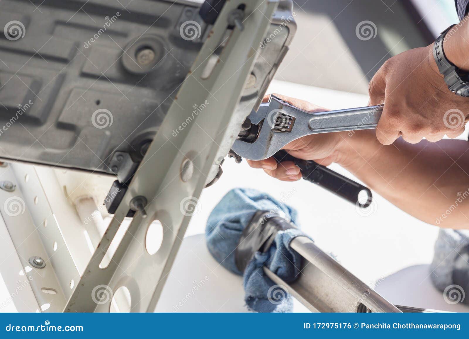 Air Conditioning Repair, Technician Man Hands Using a Wrench Fixing ...