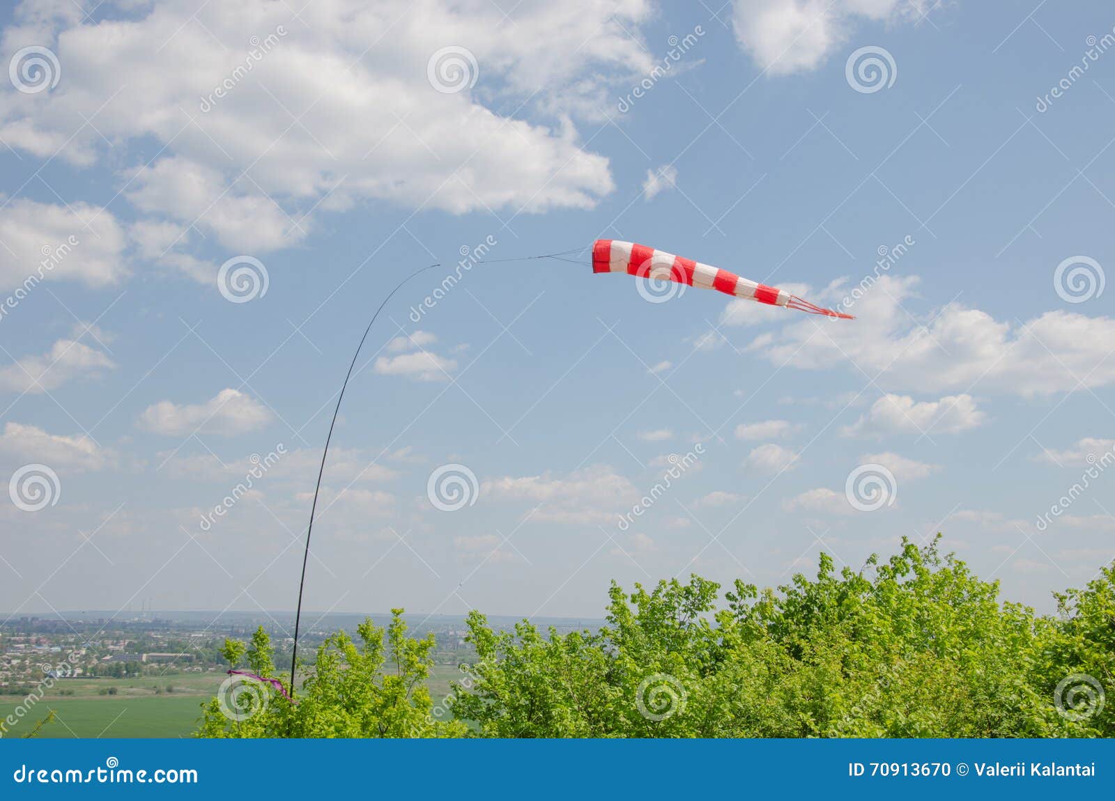 Air Field Direction Sign and a Wind Force Windsock Against the Blue Sky ...