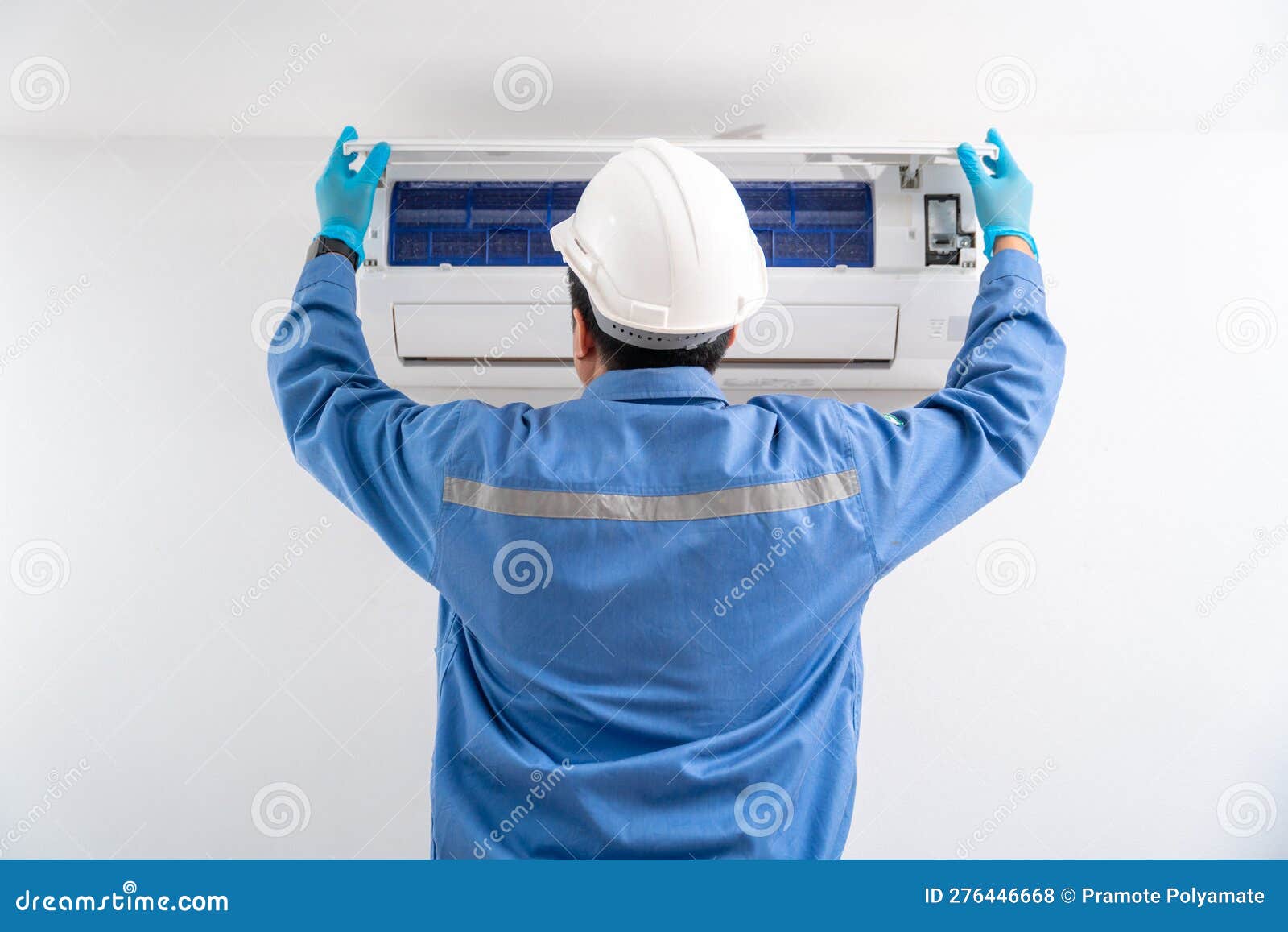 Air Technician Service Fixing Air Conditioner on White Wall Indoors ...