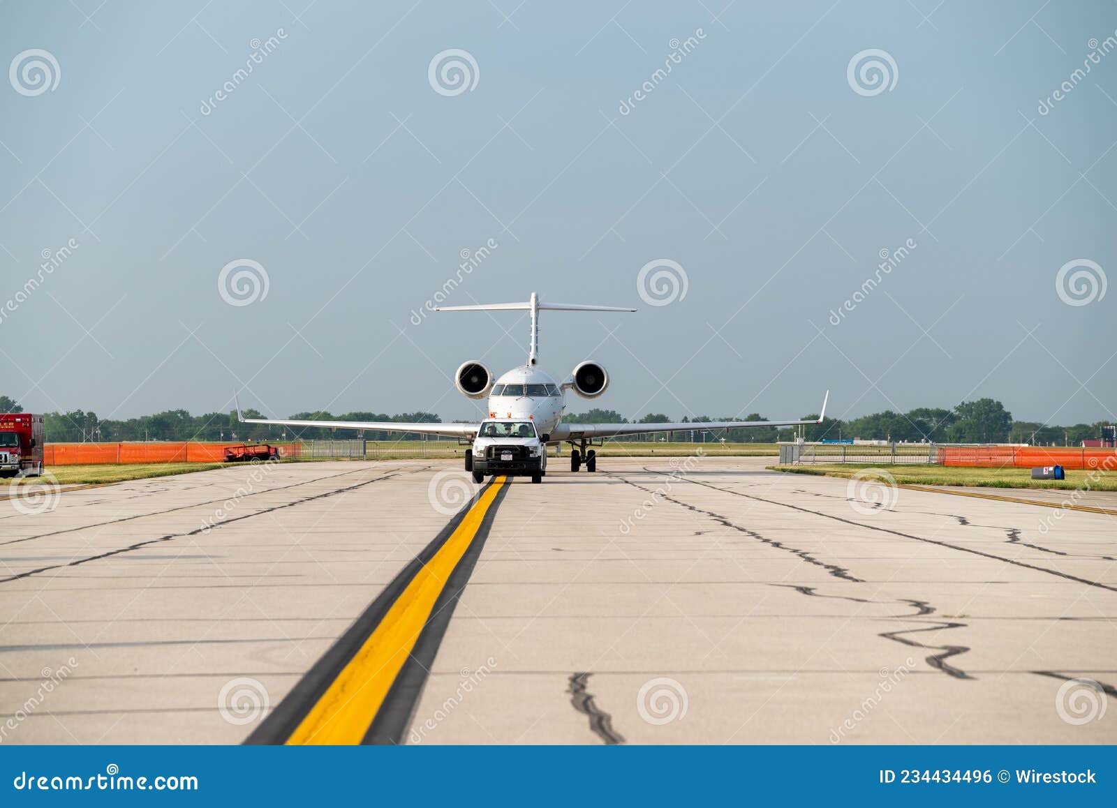 Aircraft Being Guided by a Car on a Runway of an Airport Editorial ...